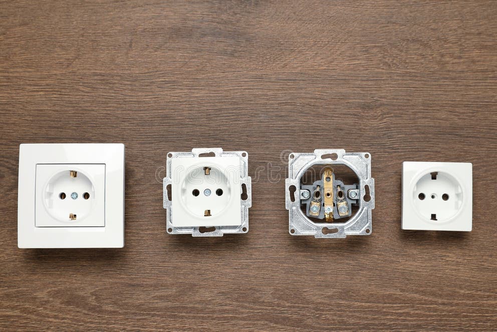 Power Sockets on Wooden Table, Flat Lay. Space for Text Stock Photo ...