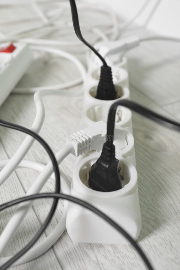 Power Strip with Different Electrical Plugs on White Floor, Closeup ...