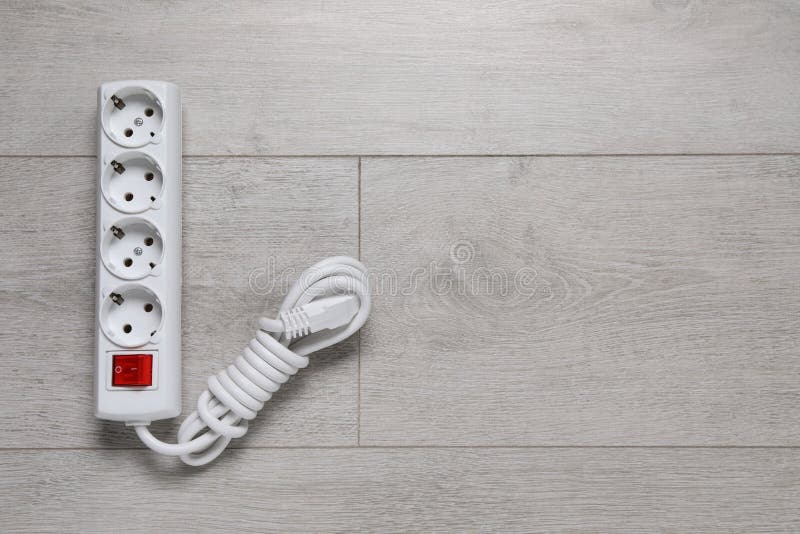 Power Strip on Wooden Floor, Top View. Space for Text Stock Photo ...