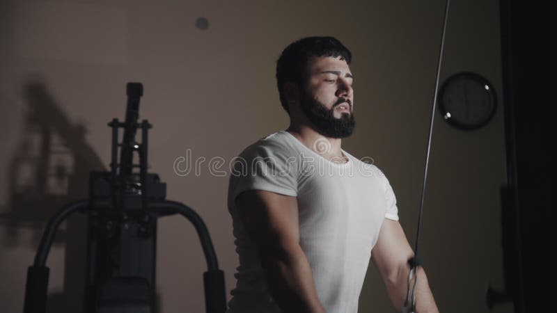 Power Strong Caucasian Man Training Triceps Muscles Pulling Cable ...