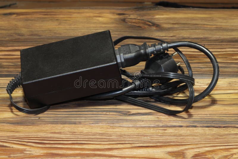 Power Supply for the Computer Lies on a Wooden Table Stock Image ...