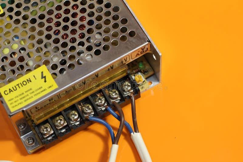 Power Supply on Orange Table Stock Image - Image of technology ...