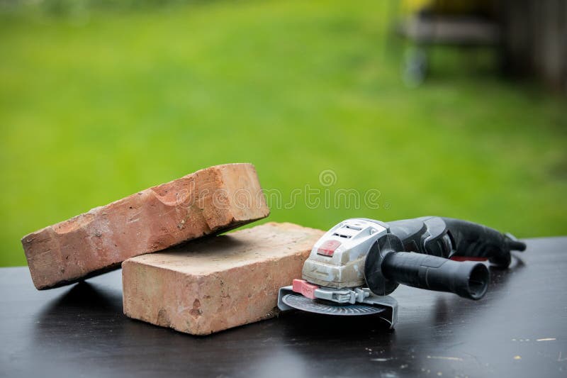 Power Tool and Bricks on Outdoor Table Ready for Masonry or ...