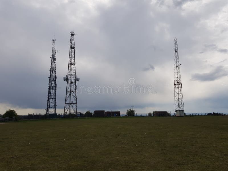Power Towers Against Rainy Sky Near Fields Stock Image - Image of ...