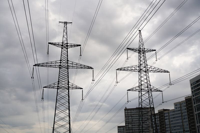 Power Transmission Line in the City with Cloudy Sky Stock Photo - Image ...