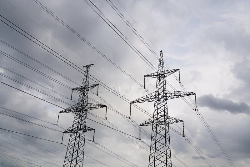 Power Transmission Line in the City with Cloudy Sky Stock Photo - Image ...