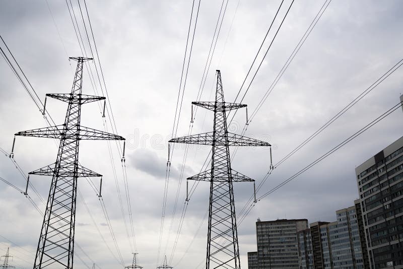 Power Transmission Line in the City with Cloudy Sky Stock Photo - Image ...