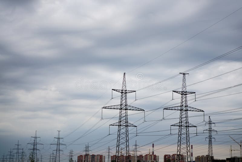 Power Transmission Line in the City with Cloudy Sky Stock Photo - Image ...