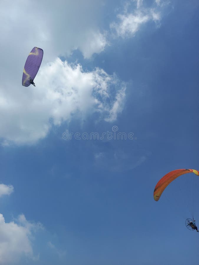 Powered Paragliding Show in the Air with Clouds in Background ...