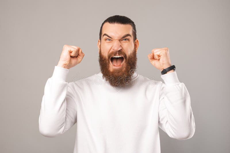 Powerful Bearded Man is Screaming and Making the Winner Gesture. Stock ...