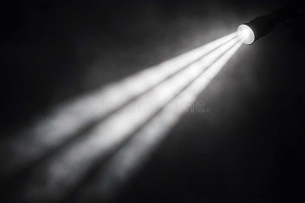 Bright Focused Light Beam Emanating from a Source in a Darkened Studio ...