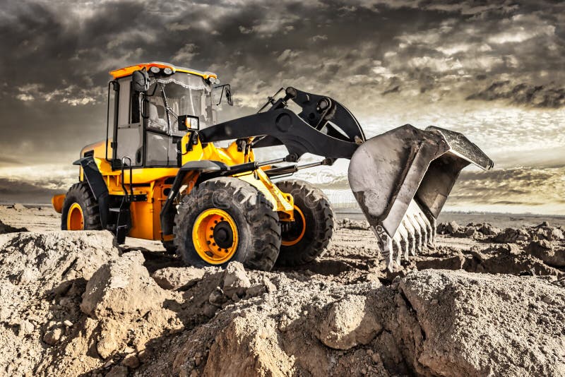 Powerful Bulldozer or Loader Moves the Earth at the Construction Site ...