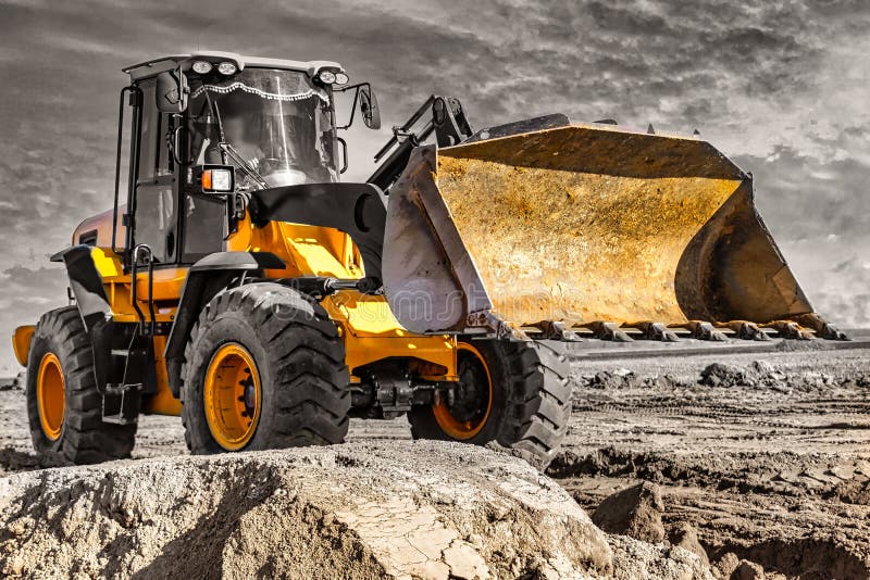 Powerful Bulldozer or Loader Moves the Earth at the Construction Site ...