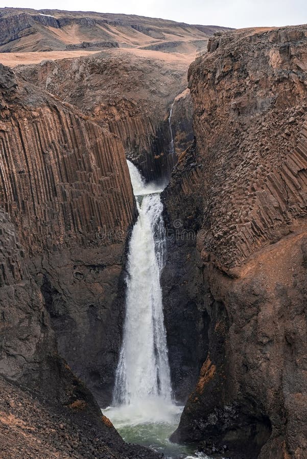 Powerful Cascades of Waterfalls. Streams of Water Collapse from Ledges ...