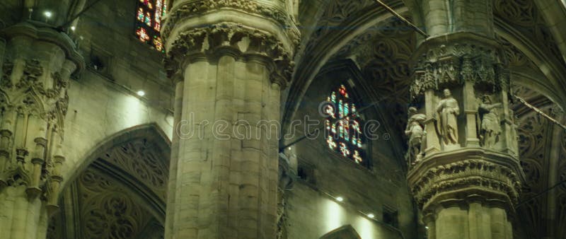 Powerful Columns with Stucco and Sculptures and Tall Arched Stained ...