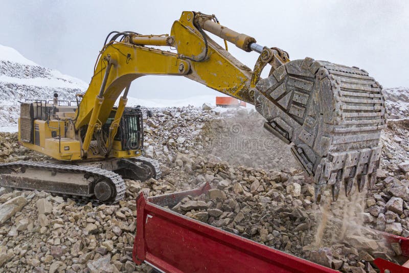 Powerful Crawler Excavator Loads the Earth into a Stock Image - Image ...