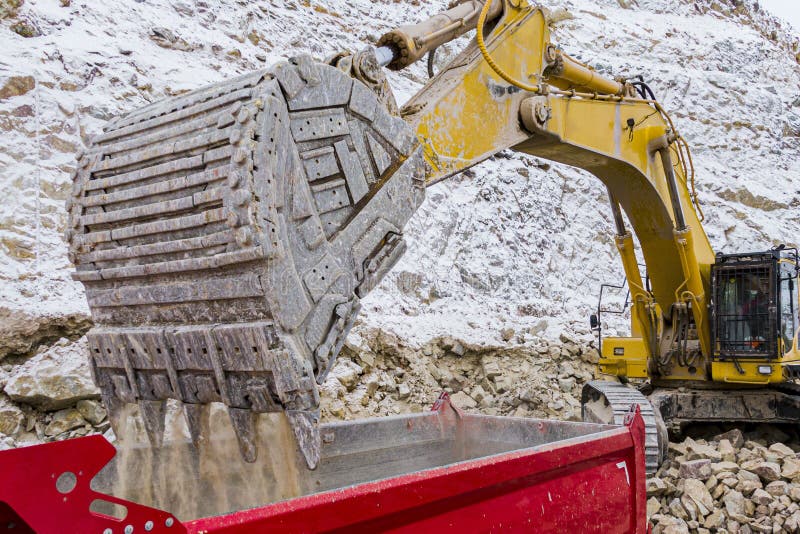 Powerful Crawler Excavator Loads the Earth into a Stock Photo - Image ...