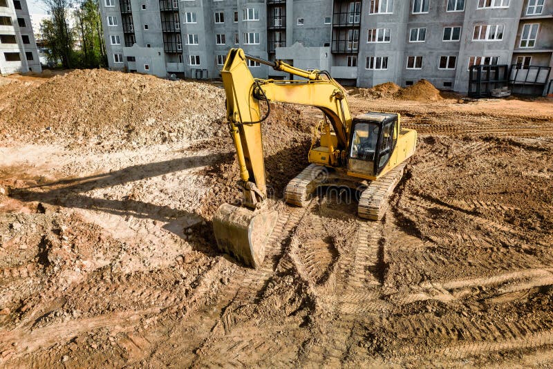 A Powerful Crawler Excavator is Working on a Construction Site. Close ...