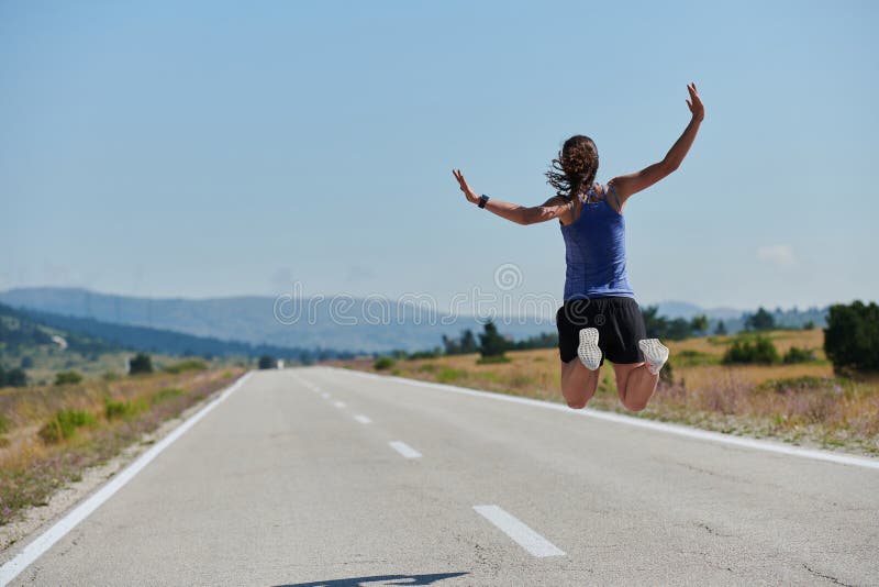 Leap of Victory: Athlete Symbolizes Success and Dedication through Mid ...