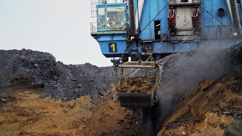 A Heavy Excavator is Actively Operating on an Earthmoving Construction ...