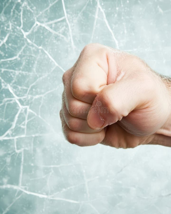 Powerful Fist Striking through Fragile Surface, Symbolizing Strength ...