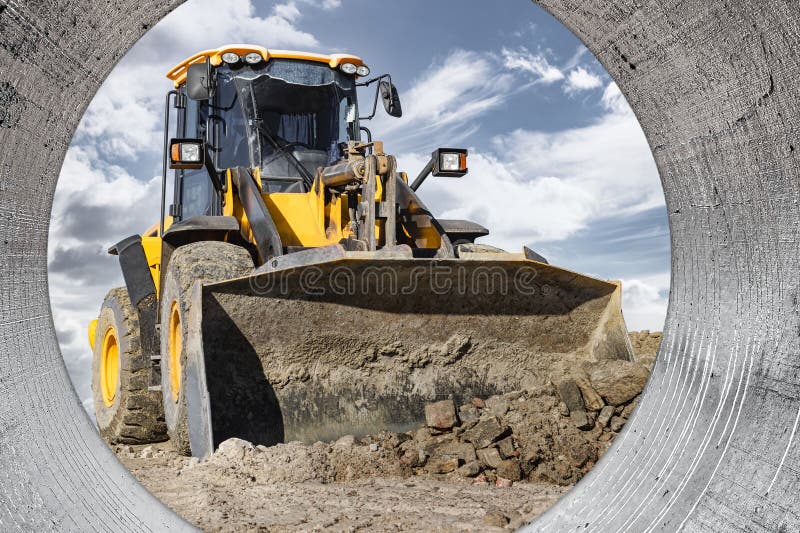 Powerful Front Wheel Loader or Bulldozer Working on a Quarry or ...