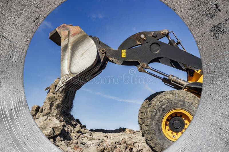 Powerful Front Wheel Loader or Bulldozer Working on a Quarry or ...