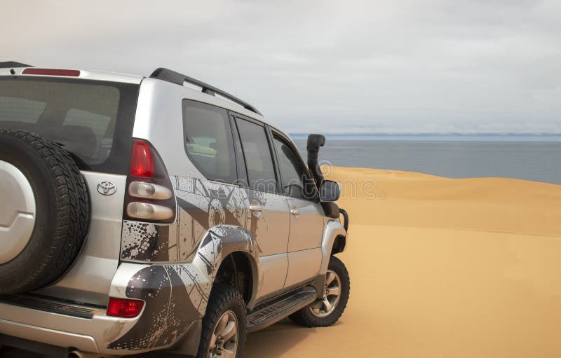 A Powerful 4x4 SUV Captured Close-up in Endless Sands, Ready for ...