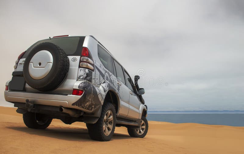 A Powerful 4x4 SUV Captured Close-up in Endless Sands, Ready for ...