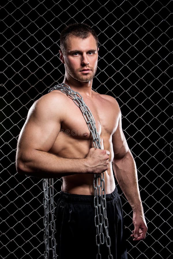 Powerful Guy with a Chain Showing His Muscles Stock Photo - Image of ...