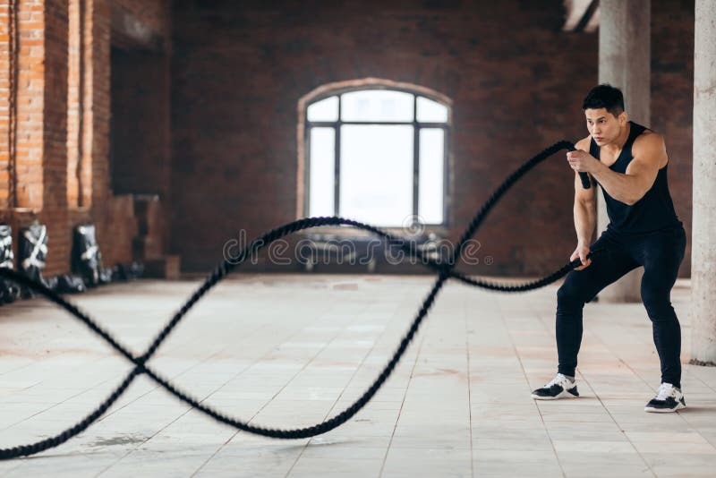 Powerful Guy Using Ropes during Cross Fit Workout Stock Photo - Image ...
