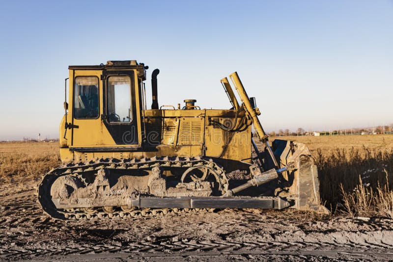 Powerful Heavy Crawler Bulldozer Works at a Construction Site in the ...
