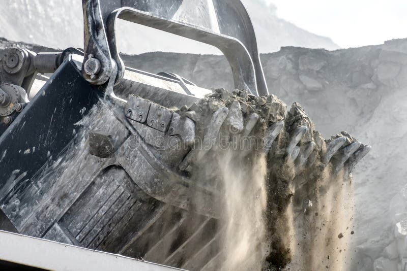 Powerful and Large Excavator Bucket. Loading of Minerals into the Body ...