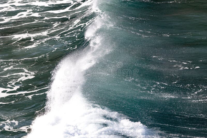Powerful Ocean Wave Cresting with White Foam and Mist Spraying into the ...