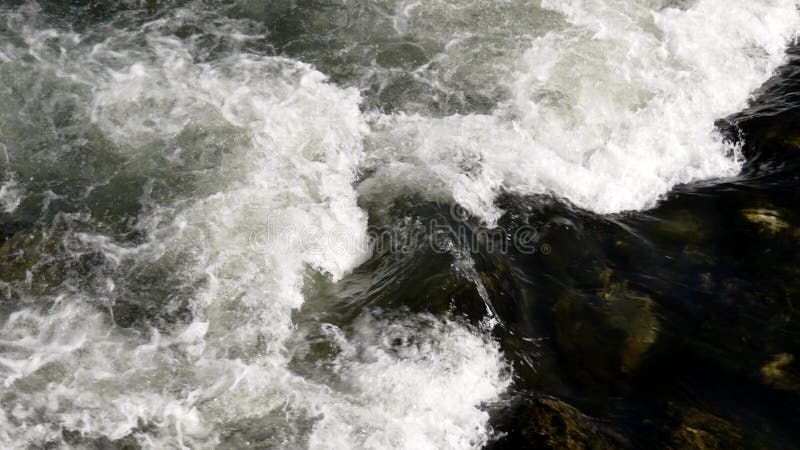 Powerful River Current Flows Over Rocky Riverbed. White Water Swirls ...
