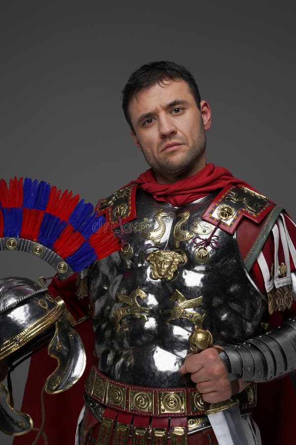 Powerful Roman Centurion with Plumed Helmet Isolated on Gray Stock ...
