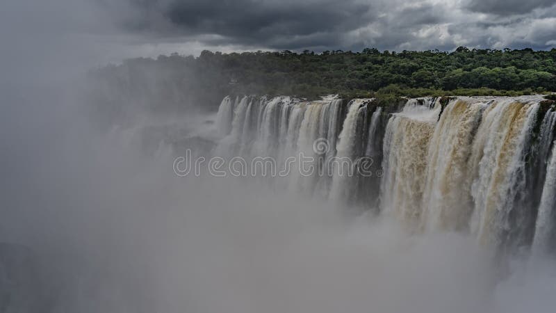 The Powerful Streams of the Waterfall Collapse from the Cliff Ledge ...