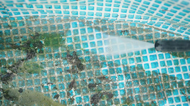 High-Pressure Cleaning Dirty Pool Surface with Jet Washer. Stream ...