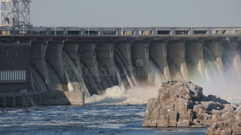 A Powerful Waterfall Cascades Down the Side of a Tall Dam Stock Footage ...