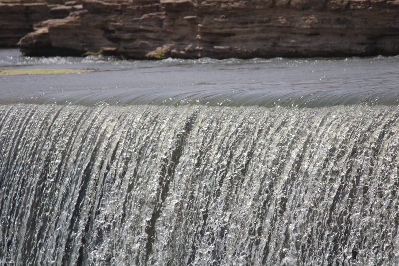 Rugged Landscape Powerful Waterfall Cascading Over Rocky Cliffs Stock ...