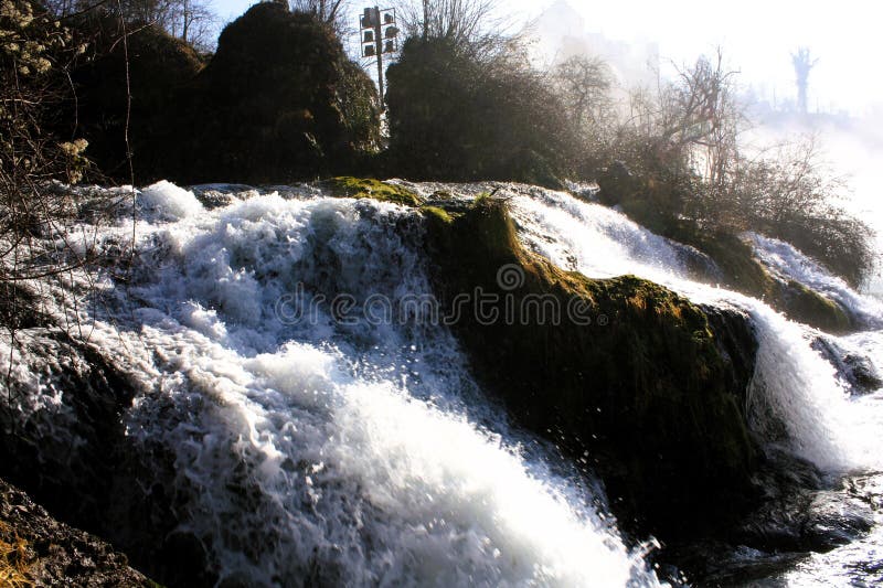 Powerful Waterfall Cascading Over Mossy Rocks in a Wild Natural Setting ...