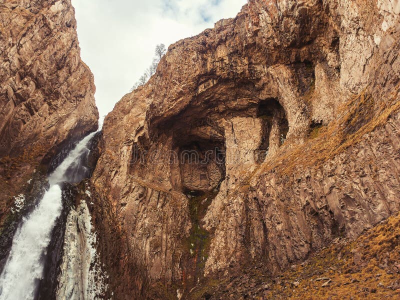 A High Powerful and Smooth Stream of a Waterfall Flows in Steep Rocks ...