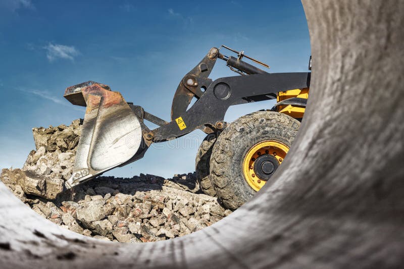 Powerful Wheel Loader or Bulldozer Working on a Quarry or Construction ...