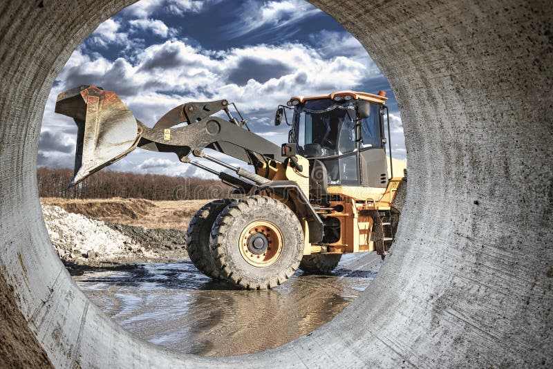 Powerful Wheel Loader or Bulldozer Working on a Quarry or Construction ...