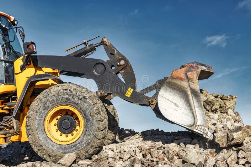 Powerful Wheel Loader or Bulldozer Working on a Quarry or Construction ...