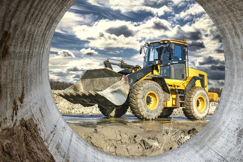 Powerful Wheel Loader or Bulldozer Working on a Quarry or Construction ...