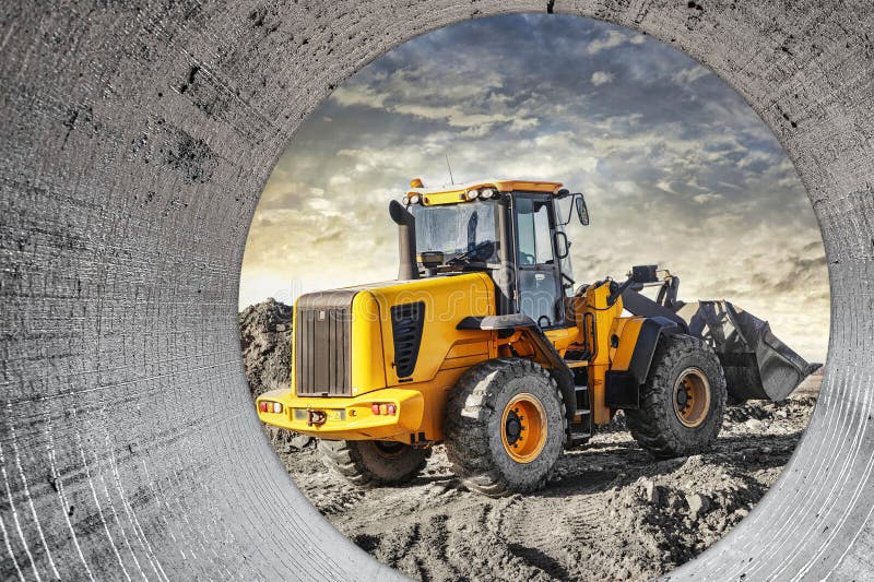 Powerful Wheel Loader or Bulldozer Working on a Quarry or Construction ...