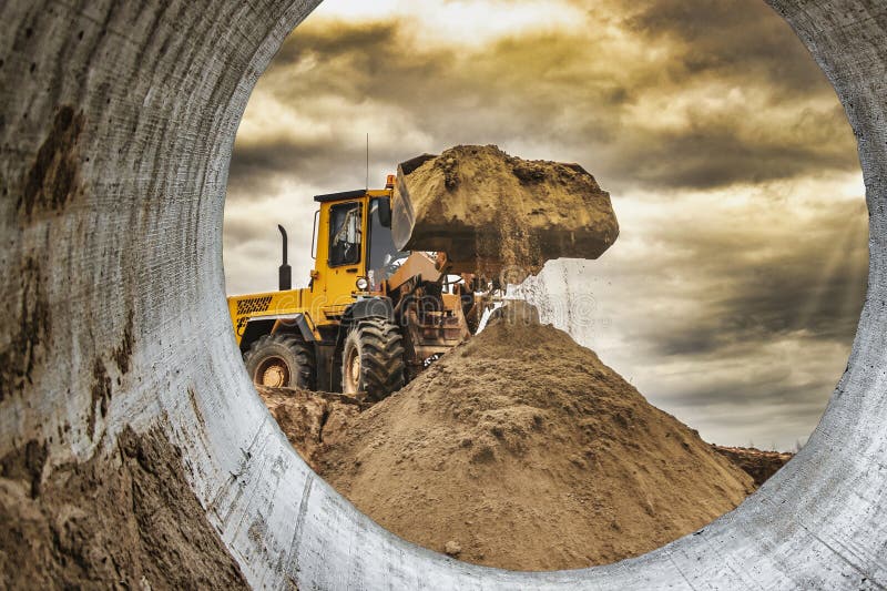 Powerful Wheel Loader or Bulldozer Working on a Quarry or Construction ...