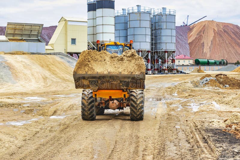 Powerful Wheel Loader or Bulldozer Working on a Quarry or Construction ...