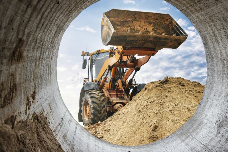 Powerful Wheel Loader or Bulldozer Working on a Quarry or Construction ...